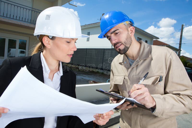 Female Site Manager with Worker Making Notes on Clipboard Stock Image ...