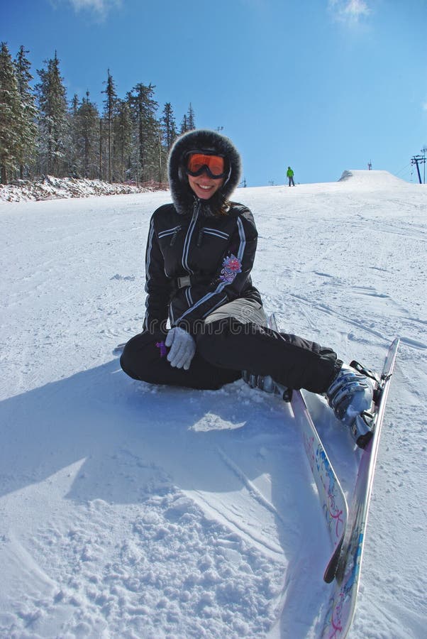 Female skier. stock photo. Image of seasonal, black, laying - 11327846