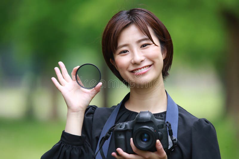 Female with SLR Camera and Lens Filter Stock Image - Image of young ...