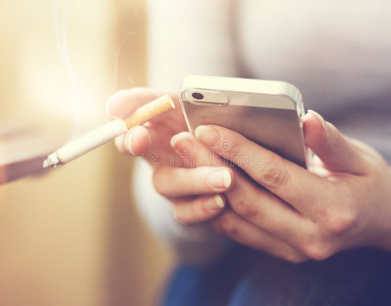Female Smoker Using a Mobile Phone Stock Photo - Image of mobile ...