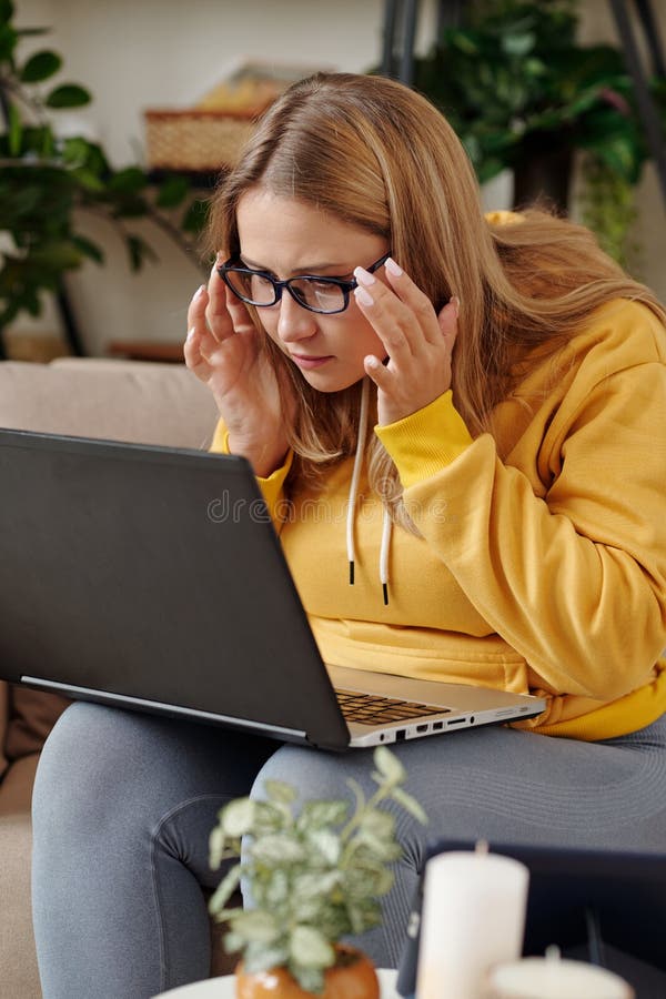 Confused female programmer stock image. Image of sofa - 214633463