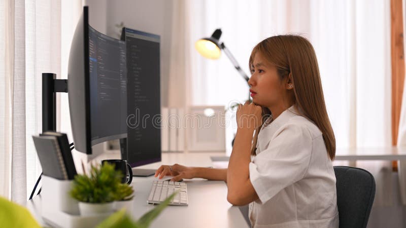 Female Software Developers Working With Coded Data On Computer Screen Developing Programming
