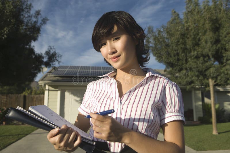 Female Solar Panel Worker Working on Blueprint Outdoors Stock Photo ...
