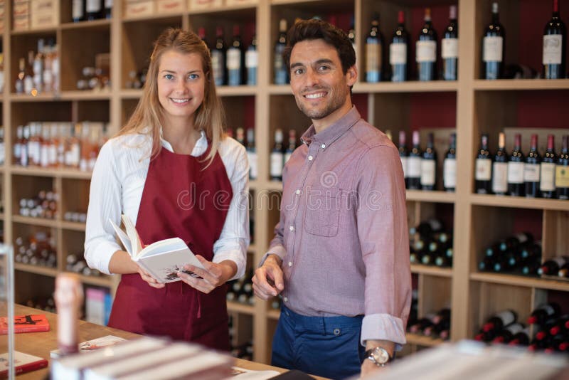 Female Sommelier Posing with Male Customer Stock Photo - Image of ...