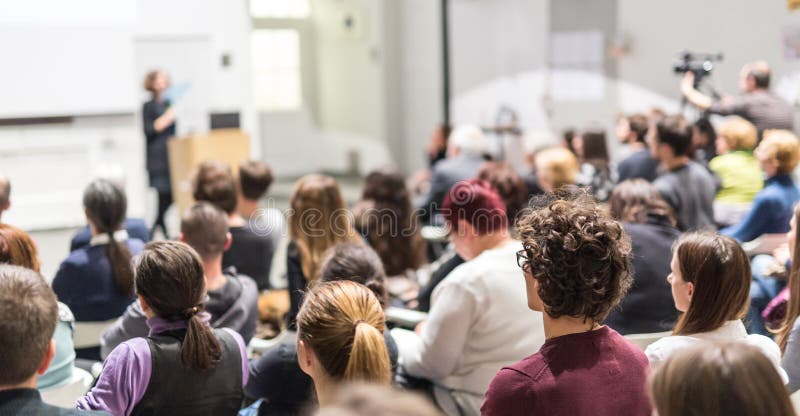 Woman Giving Presentation in Lecture Hall at University. Editorial ...