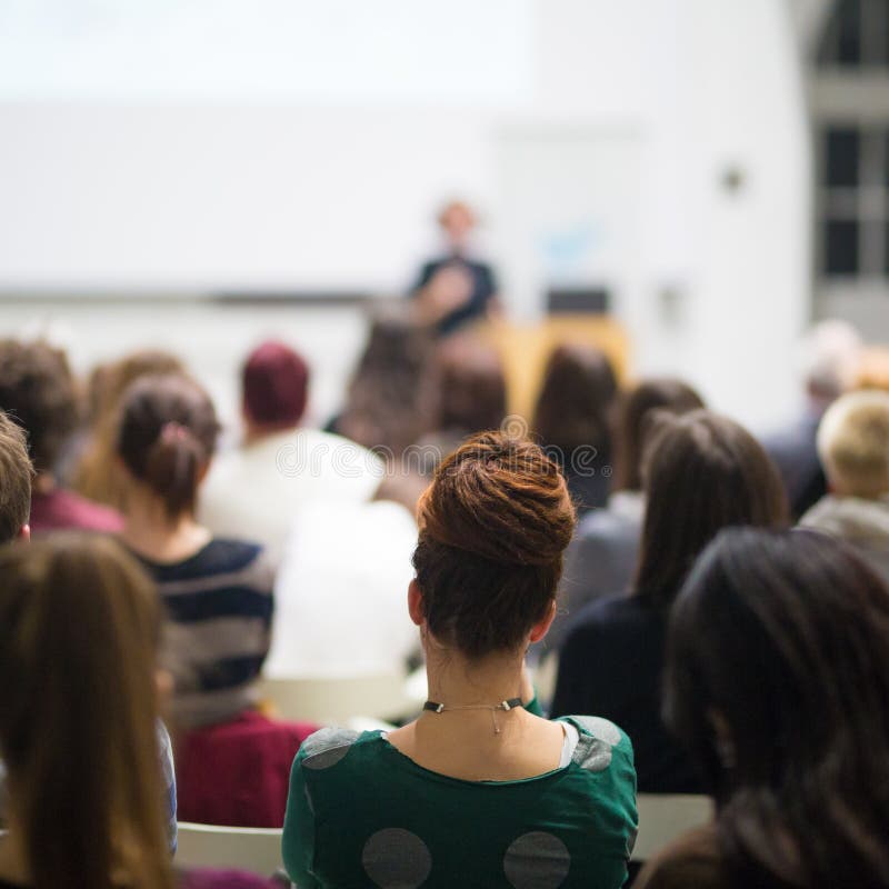 Woman Giving Presentation in Lecture Hall at University. Editorial ...