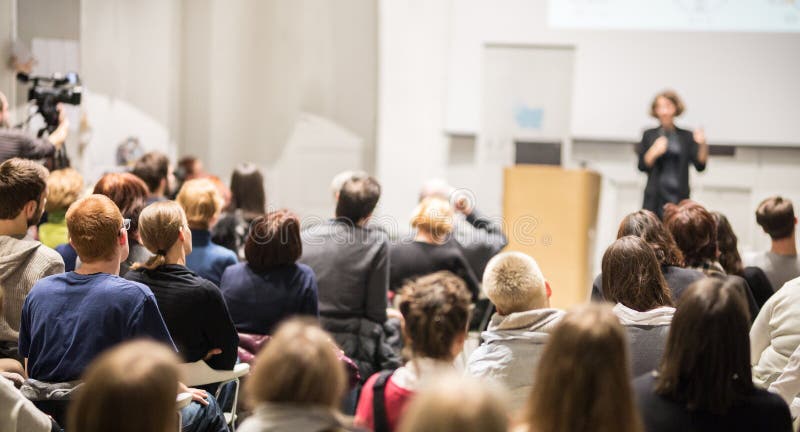 Woman Giving Presentation in Lecture Hall at University. Editorial ...