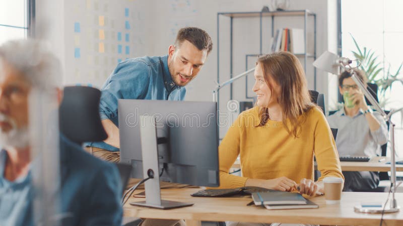 Female Specialist Works on Desktop Computer, Project Manager Stands ...