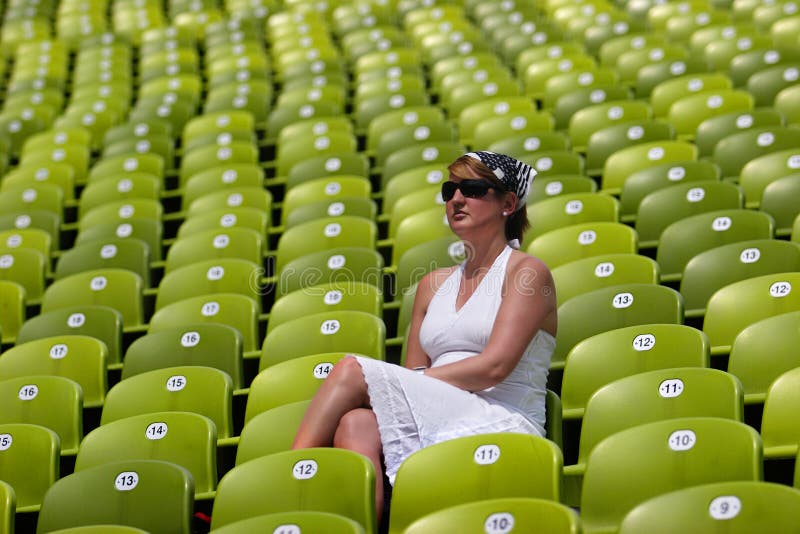 A Female Spectator in the Sun Stock Photo - Image of bleachers, numbers ...