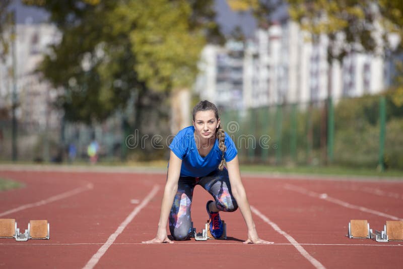 Female Sprinter Getting Ready To Start the Race Stock Photo - Image of ...