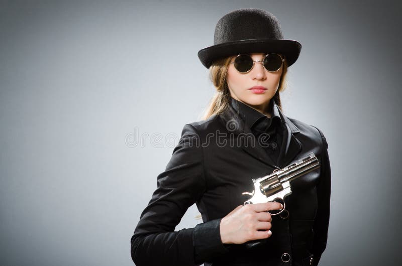The Female Spy with Weapon Against Gray Stock Image - Image of lady ...