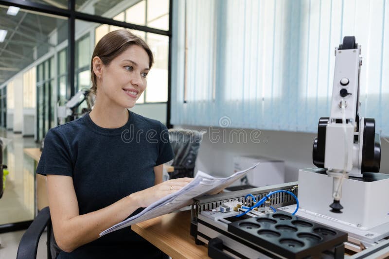 Female Staff Engineer Working System Robot. Education Classroom for ...