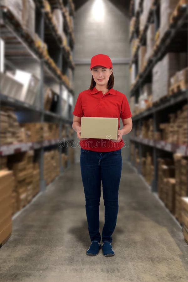 Female Staff Lifting Parcel Boxes in the Warehouse Stock Photo - Image ...