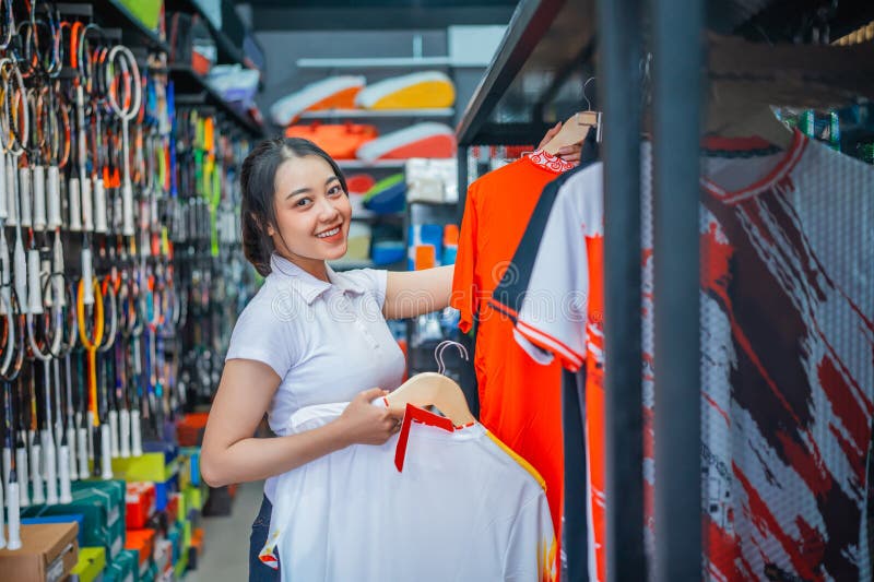 Female Staff Smiling Working Putting Athletic Clothing Stock Image ...