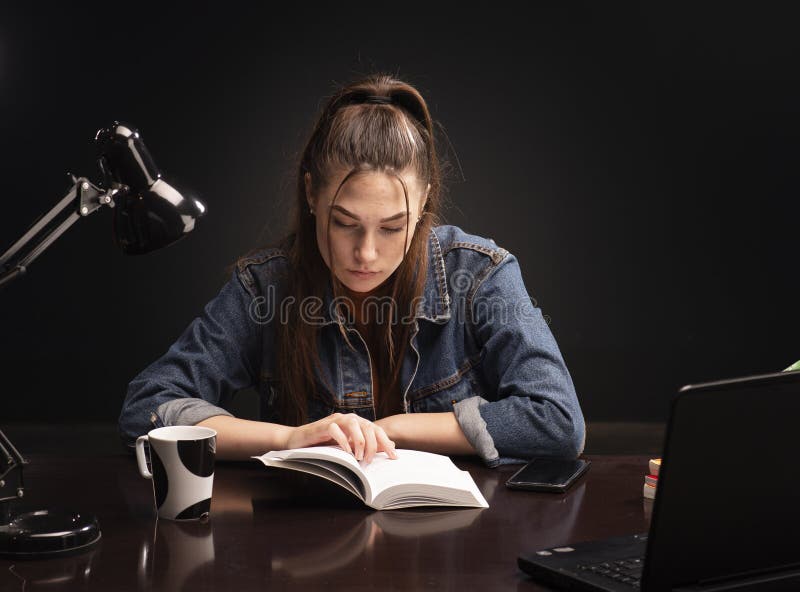 The Girl is Sitting at the Table and Study Stock Image - Image of ...
