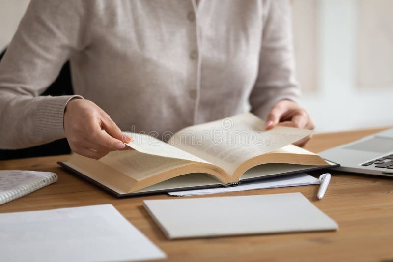 Female Student Busy Studying Reading Book in Classroom Stock Photo ...