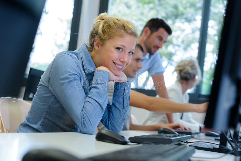 Female Student in Computer Room Smiling at Camera Stock Photo - Image ...