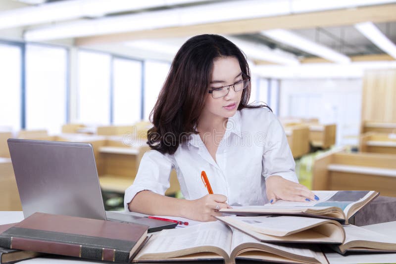 Female Student Doing Assignment in Class Stock Image - Image of ...