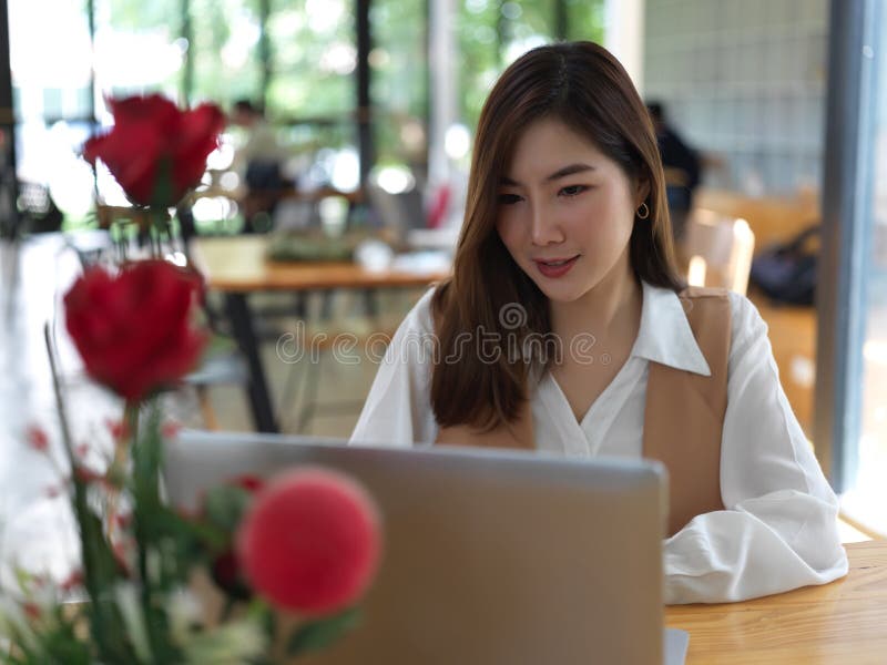 Female Student Doing Assignment with Laptop on Table Stock Image ...