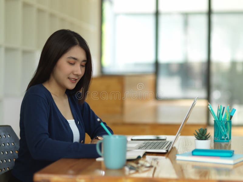 Female Student Doing Assignment with Tablet on Wooden Bar in Cafe Stock ...