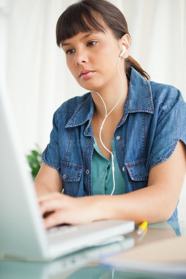 Female Student Doing Her Homework with Music Stock Image - Image of ...