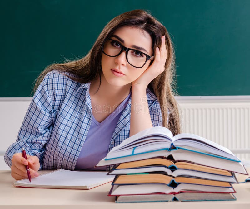 Female Student in Front of Chalkboard Stock Photo - Image of ...