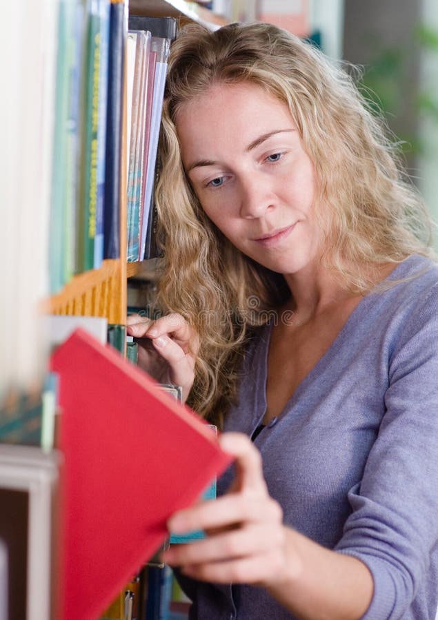 Female Student Getting Books in a Library Stock Photo - Image of ...