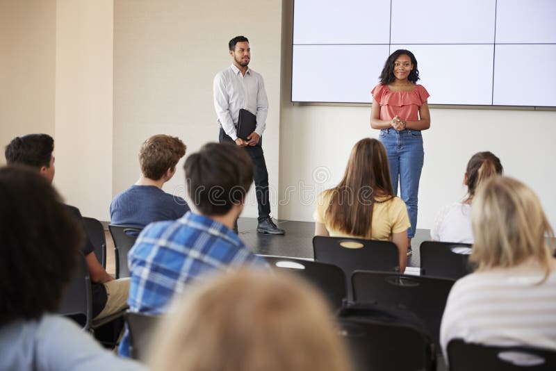 Female Student Giving Presentation To High School Class in Front of ...
