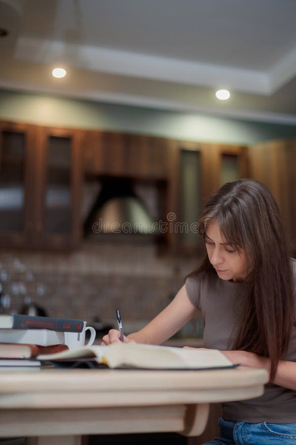 Female Student Learning and Preparing Exam at Home. Woman Reading ...