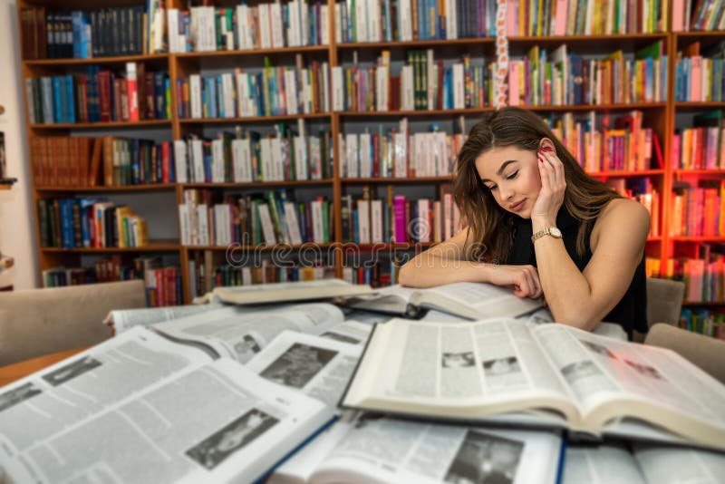 Female Student Looking for Book in University Library Stock Image ...
