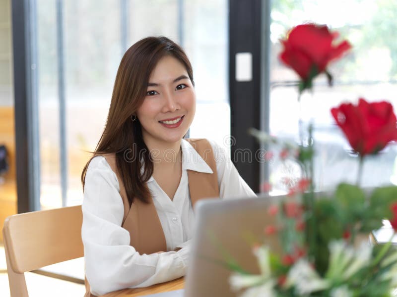 Female Student Looking into Camera while Doing Assignment Stock Image ...