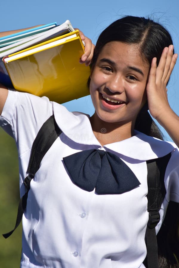 Female Student Memory Problems Holding Textbooks Stock Photo - Image of ...