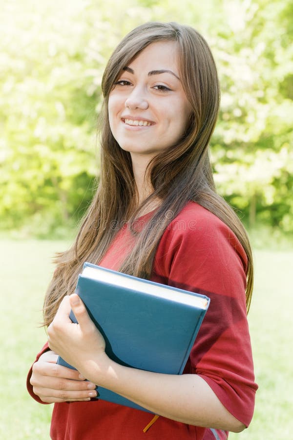 Female student outdoors stock photo. Image of education - 19524956