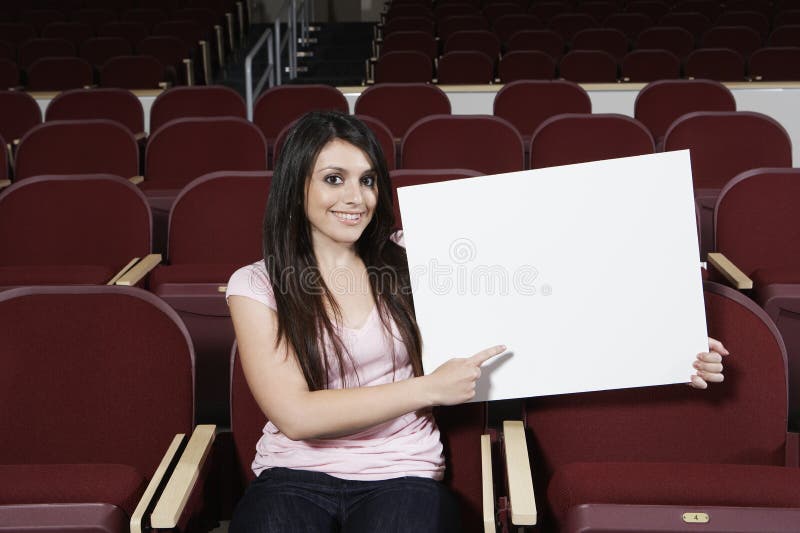 Female Student Pointing Towards Sign Board in Classroom Stock Image ...
