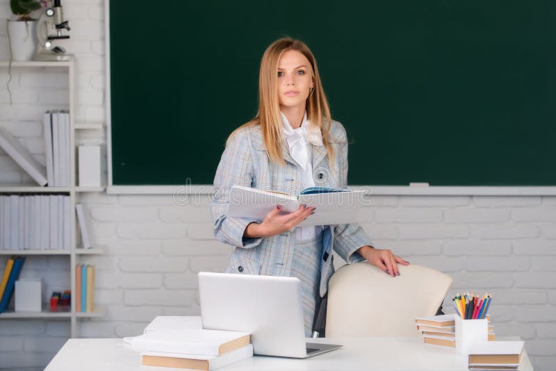 Female Student Preparing Exam and Learning Lessons in School Classroom ...