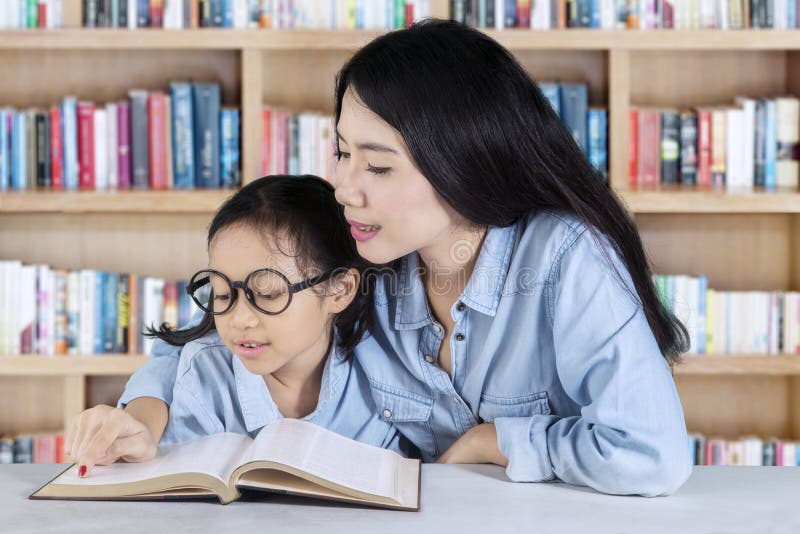Female Student Read a Book with Teacher Stock Photo - Image of ...