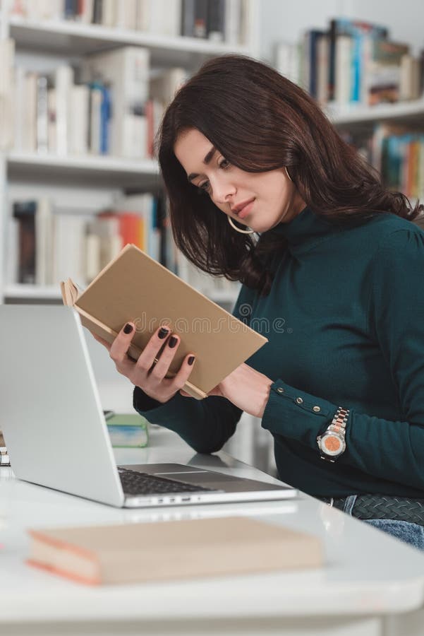 Female Student Reading Book Stock Image - Image of laptop, connection ...