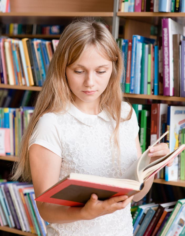 Female Student Reading Book in Library Stock Photo - Image of adult ...