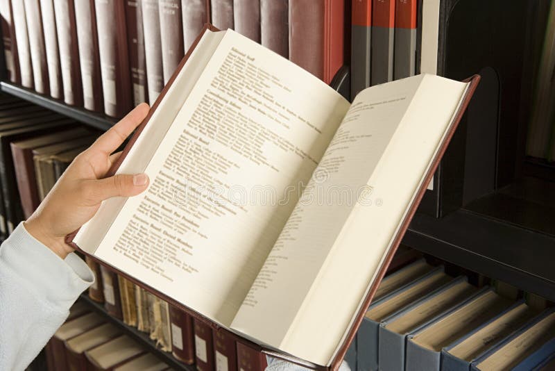 Female Student Reading a Book in the Library Stock Photo - Image of ...