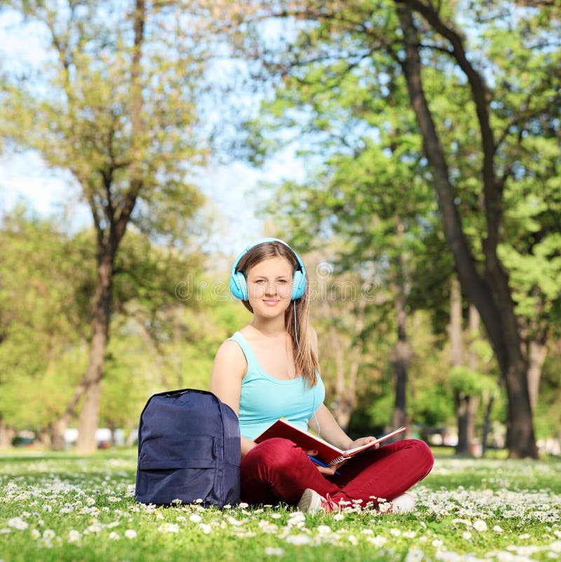 Female Student Reading a Book in Park Stock Image - Image of girl ...