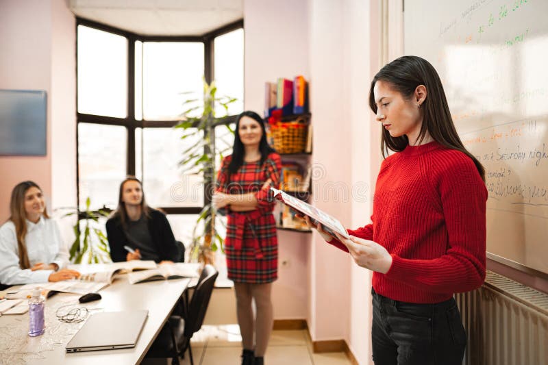 Female Student Reading at Language School Stock Photo - Image of ...