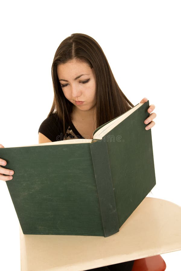 Female Student Reading a Large Book with a Confused Expression Stock ...