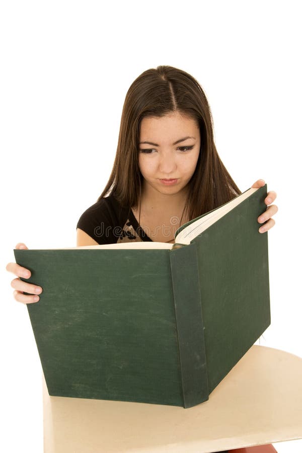 Female Student Reading a Large Book at a School Desk Stock Image ...