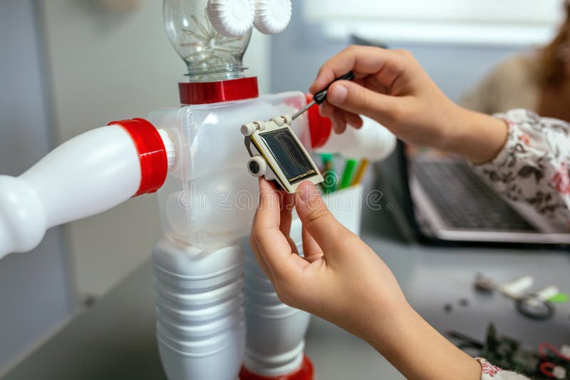 Female Student Connecting Wire on Electrical Circuit in Robotics Class ...