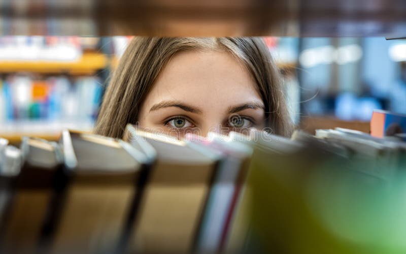Female Student Searching through Library Books Stock Image - Image of ...