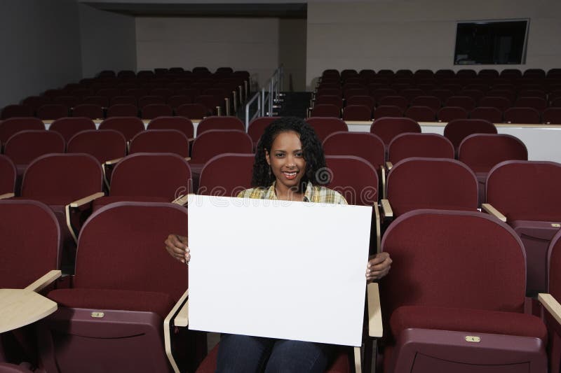 Female Student with Sign Board in Classroom Stock Image - Image of ...