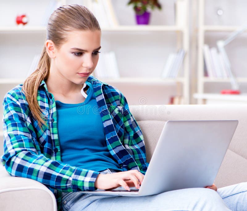 Female Student Sitting on the Sofa with Laptop Stock Image - Image of ...