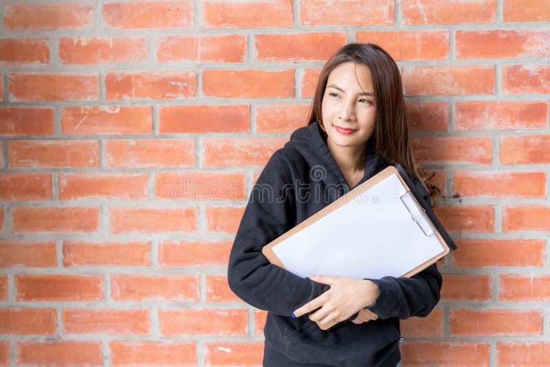 Female Student Stand at Wall at Campus Stock Photo - Image of ...
