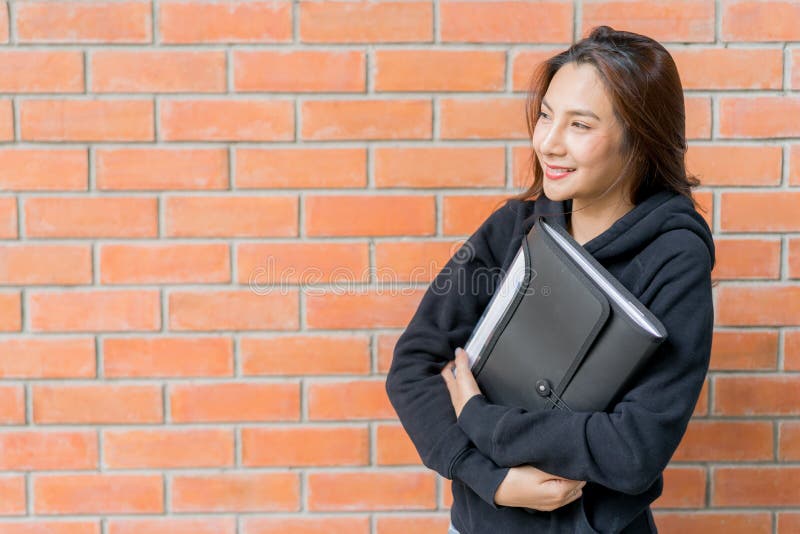 Female Student Stand at Wall at Campus Stock Image - Image of ...