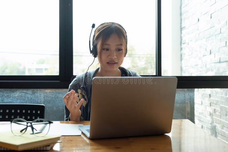 Female Student Study in the Cafe Coffee Shop. she Using Laptop and ...